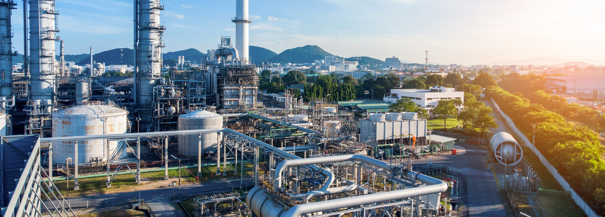 Aerial view of chemical oil refinery plant, power plant on blue – Texas Sampling